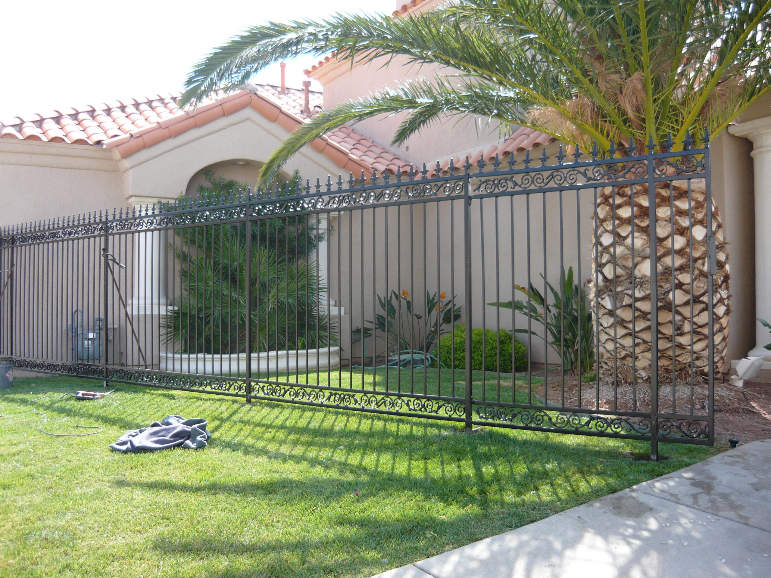 5 Design Principles for Fencing In Small Backyards with Iron Fencing